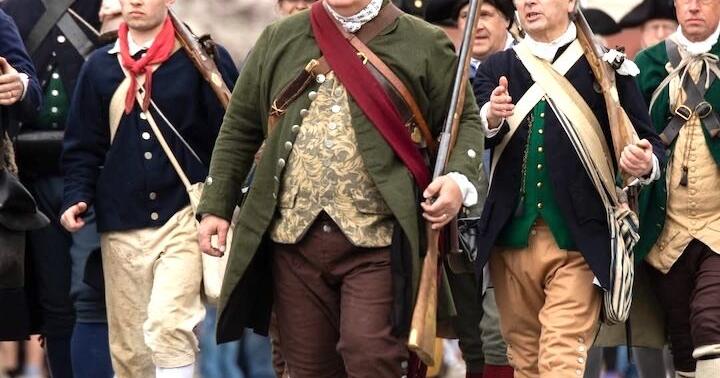 Marching Toward History: Reenactors Tom Coots and Joseph Brown prepare ...