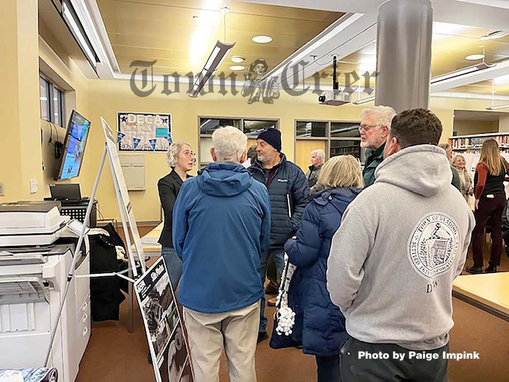 Residents listen to Remedial Project Manager Melanie Morash during a ...
