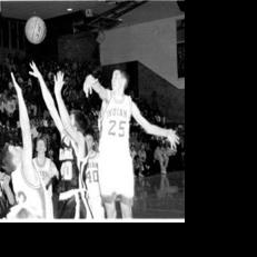 ATTEMPTED BLOCK FAILS. Lawrenceville's Tyler Wolfe (25) tried to block ...
