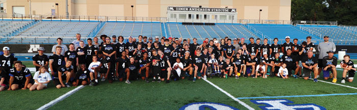 Minnetonka students come together at special needs football camp ...