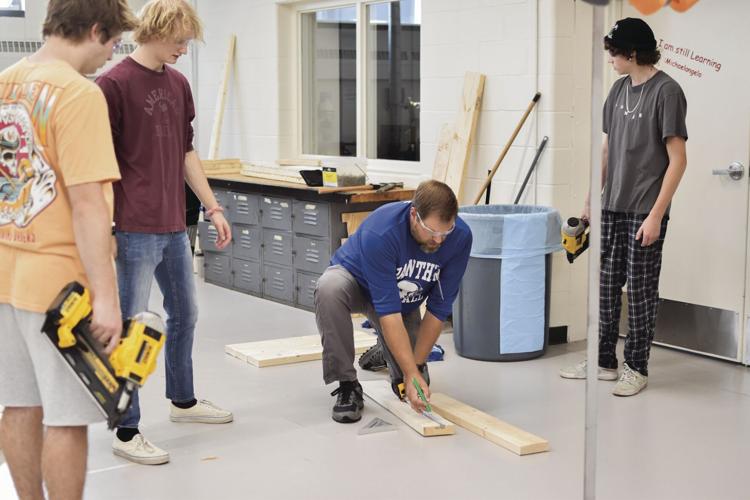 SLP High School students learn about construction by building home ...