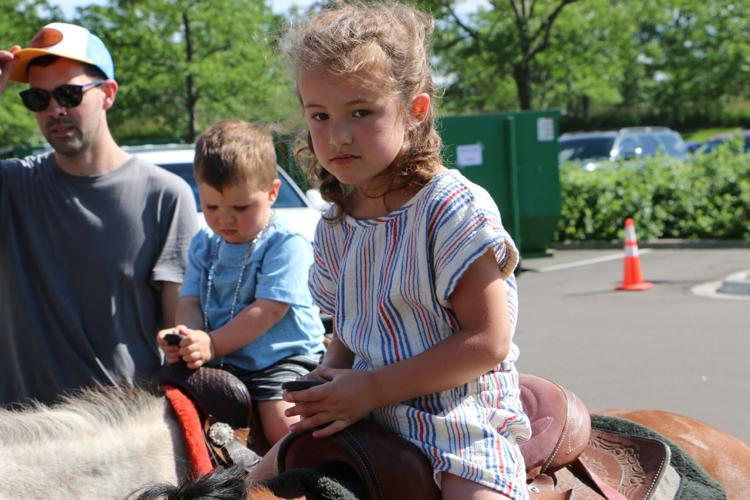Children delight in pony rides at Funfest in Eagan | Free ...