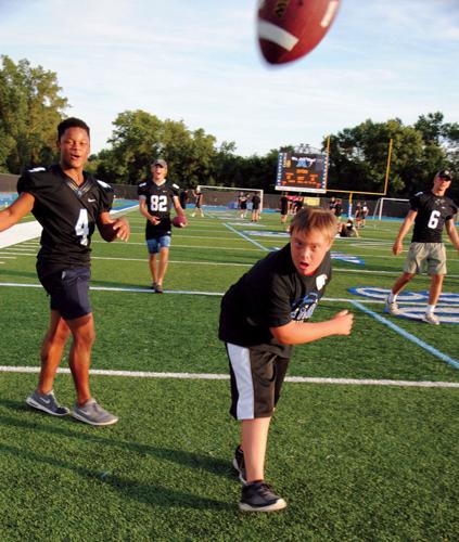 Minnetonka students come together at special needs football camp ...