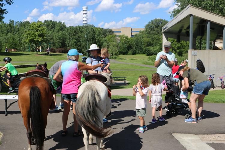 Children delight in pony rides at Funfest in Eagan | Free ...