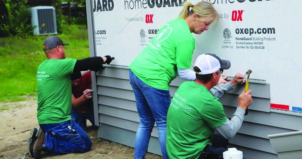 Stearns Electric volunteers at Habitat house | Community ...