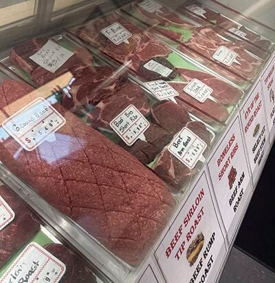 Owner fully enjoying his work at Belgrade Meat Center | Dairyland Peach ...