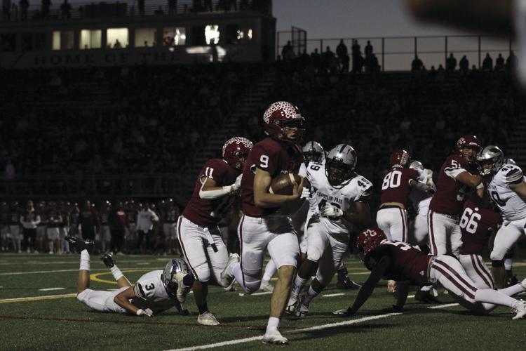 Crimson football stays undefeated after thrilling win over Champlin ...
