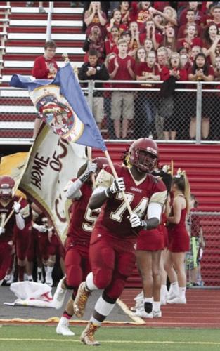 Blazing a Crimson gridiron trail: Awosika becomes first Maple Grove ...