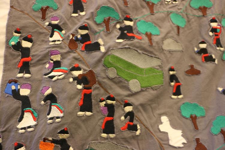 Hmong American artist stitches refugee story on intricate wall cloths ...