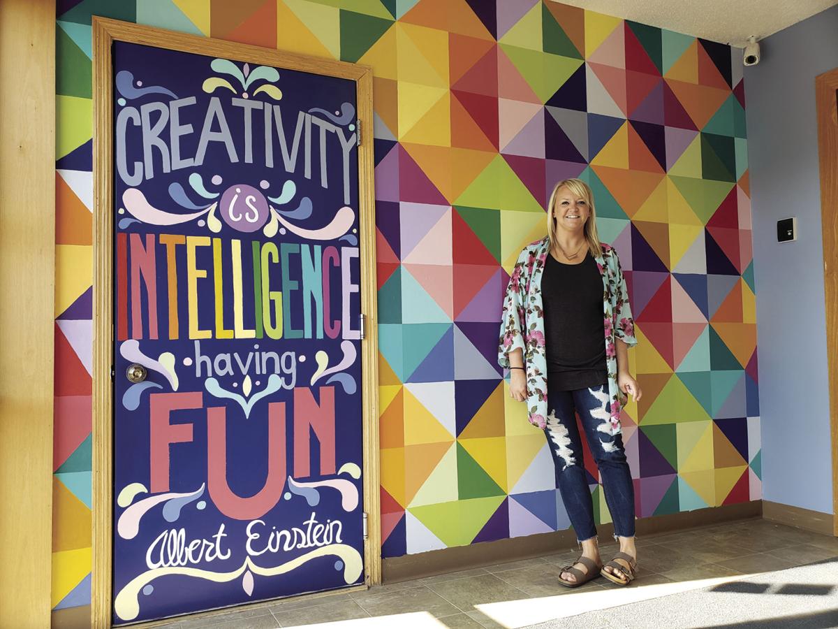 Teacher shares love for art, enhances school atmosphere | Education ...
