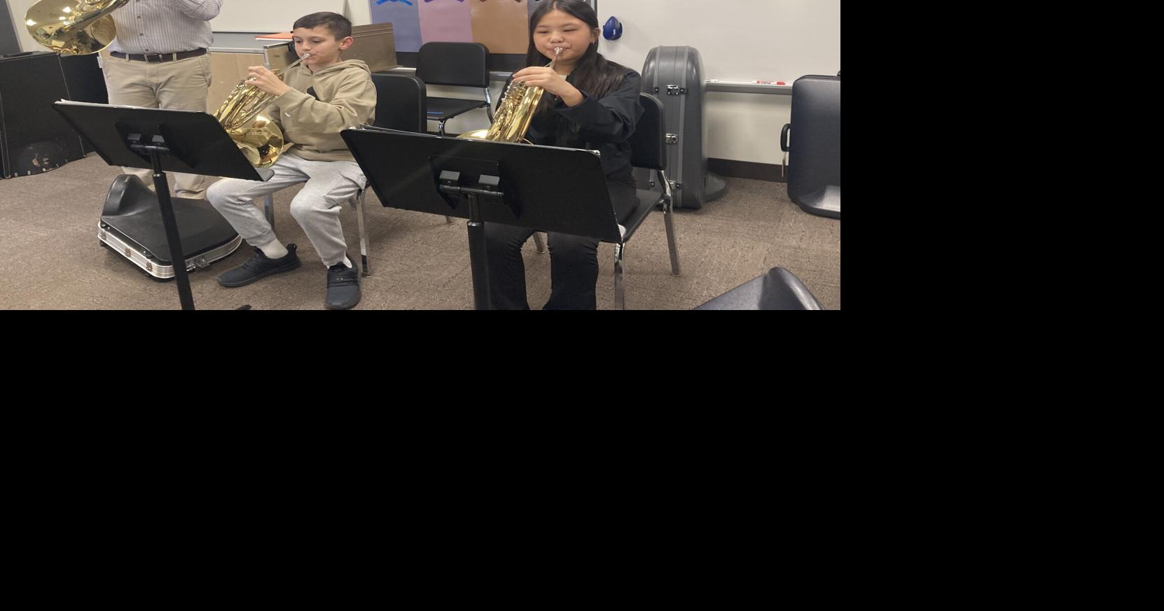Fifth-grade band educator teaches students first instruments ...