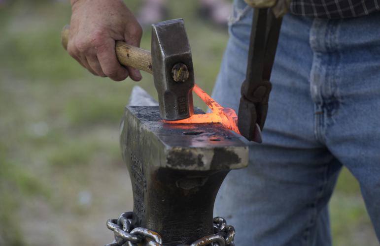 Mennonite blacksmiths forge guns into garden tools | Local News ...