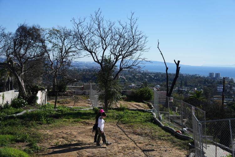 Mourners mark a year since Los Angeles wildfires, in photos | Us ...
