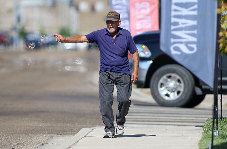 Stories from the street: Larry Meek walks and waves goodwill ...