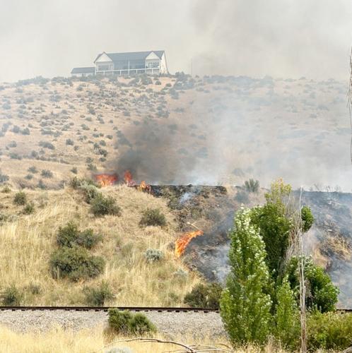 Fire crews stop wildfire blaze short of Pickett's Corral homes | Local ...