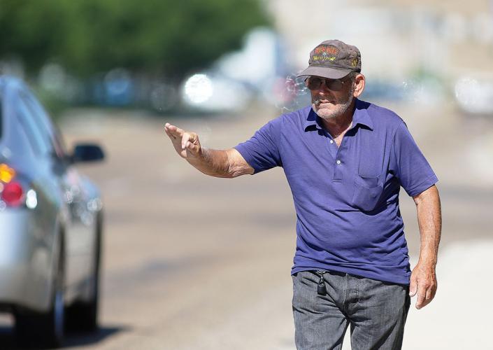 Stories from the street: Larry Meek walks and waves goodwill ...