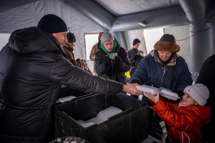 Ukrainians endure freezing temperatures at home as crews rush to ...