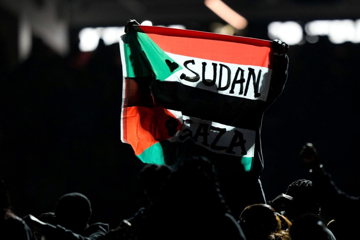 Super Bowl halftime performer who ran with a protest flag is found ...