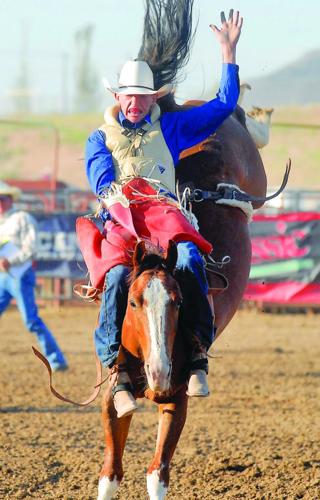 Hanging on for time: State rodeo kicks off as cowboys and cowgirls ...