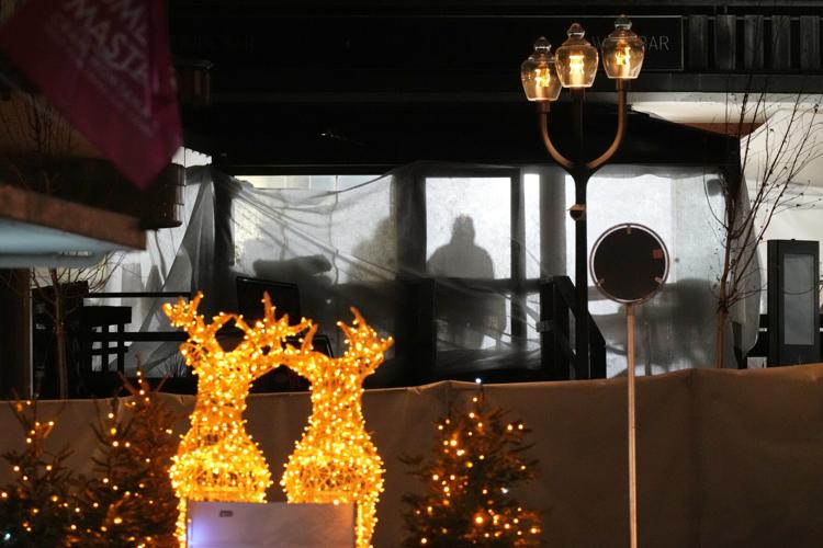 Swiss investigators believe sparkling candles atop wine bottles ignited ...