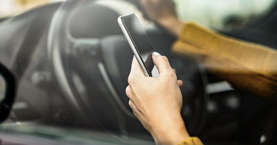 Burlington driver texting while driving, child in front seat