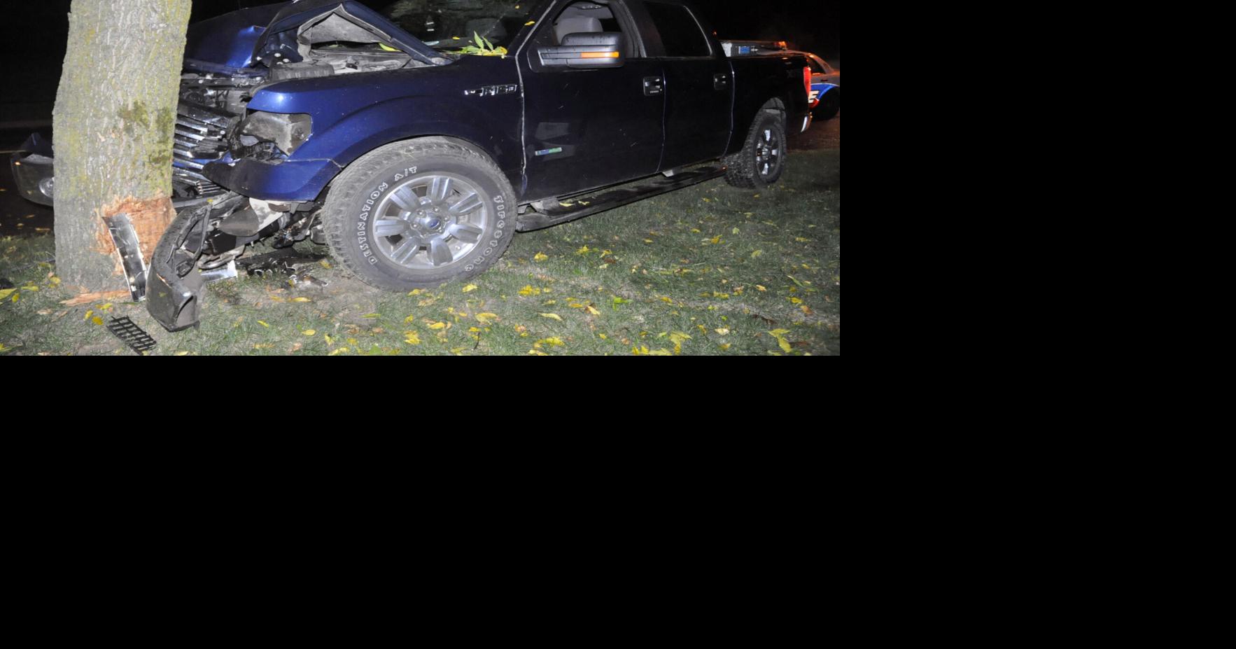 Truck crashes into tree, man charged