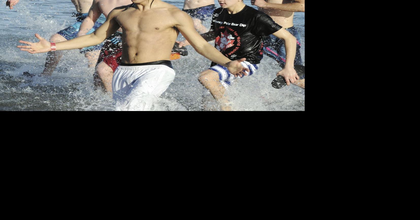 Warm weather attracts thousands to watch annual Courage Polar Bear Dip ...