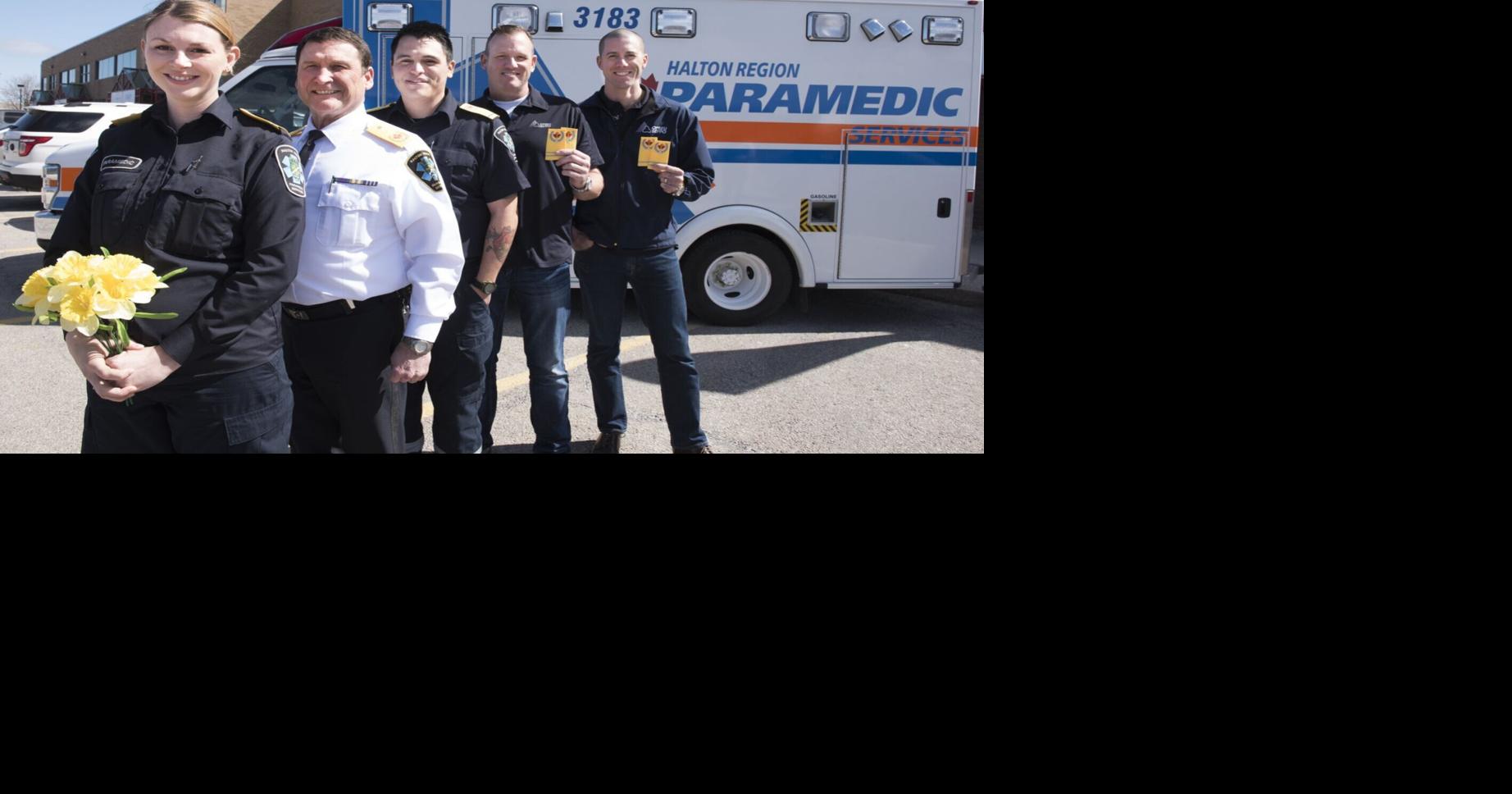 Halton paramedics wearing yellow epaulettes to support cancer society