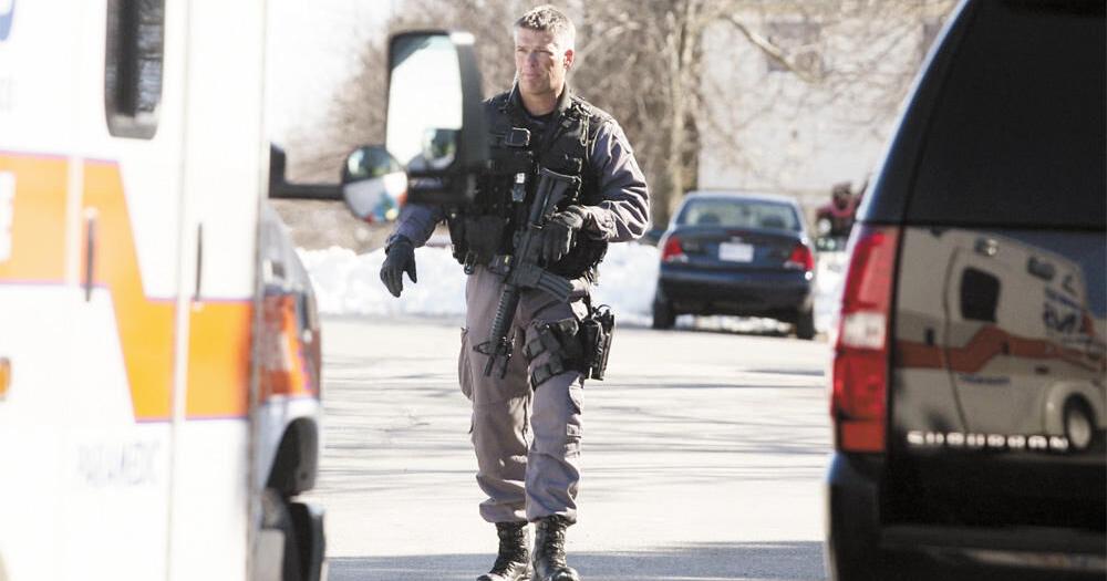 Police Tactical Rescue Unit surrounds townhouse complex