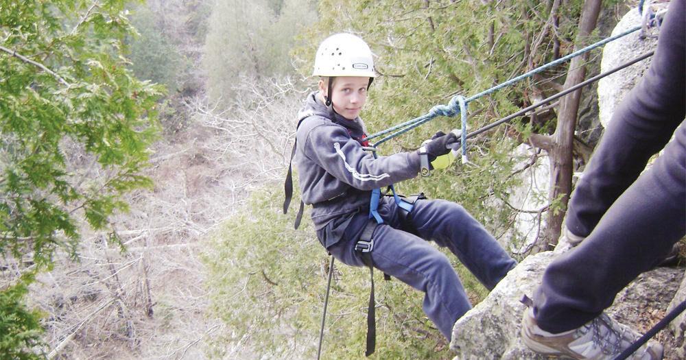 Area Scouts live on the edge at rappelling adventure camp