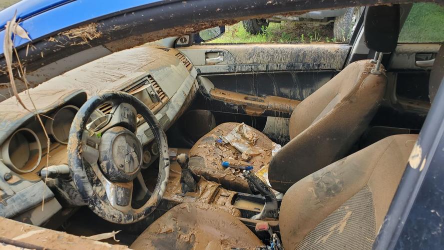 Flooding washes away cars, traps customers and staff at Tim's ...