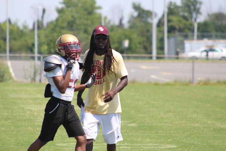 Osbourn graduate Brandon Hogan returns to high school football as a ...