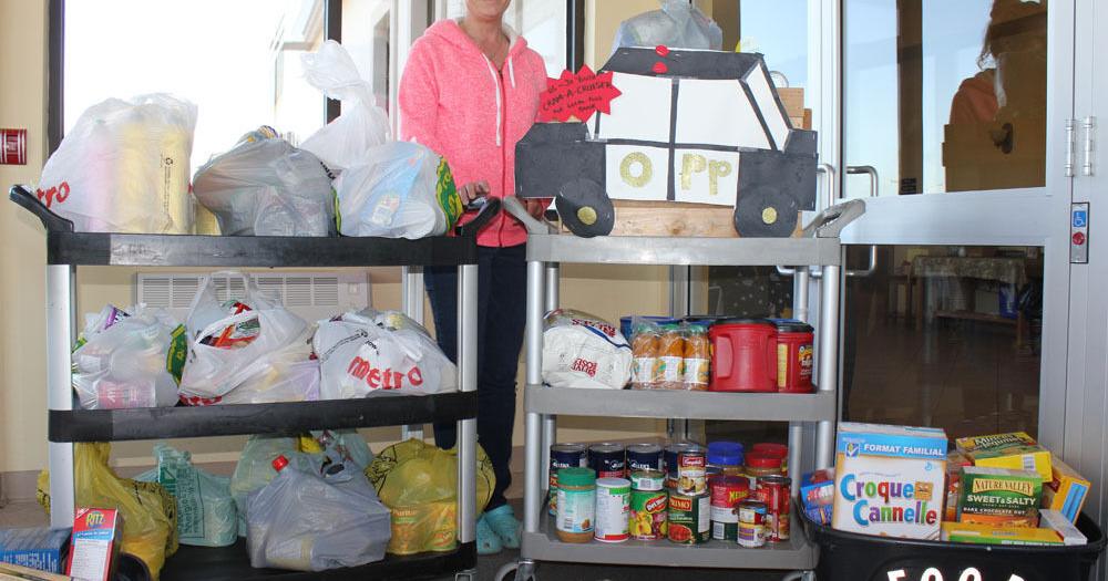 Church kids stuff OPP cruiser full of food, hope