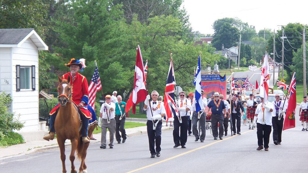 Orange sashes, white chargers for July 12th King Billy parade
