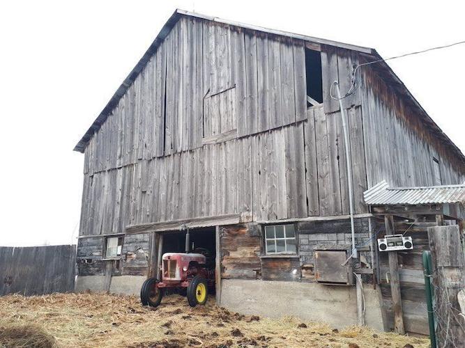 Farmer laments losses after barn fire on Walter Bradley Rd.