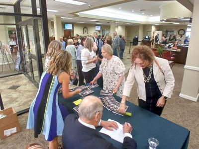 Book signing event fills Austin Bank’s lobby | Local News ...