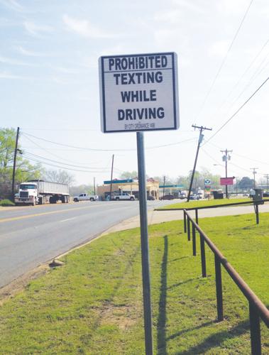 Signs go up warning drivers against texting while driving | News ...