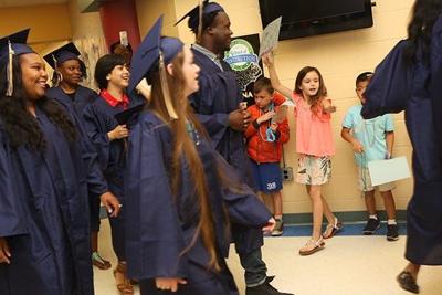 Elementary students cheer on upcoming graduates at Senior Walk | News ...