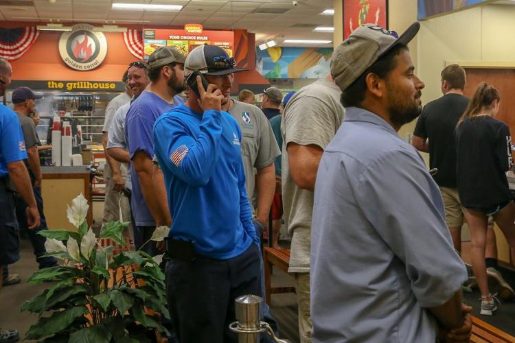 PHOTOS: Utility workers enjoy dinner thanks to Golden Corral | News ...