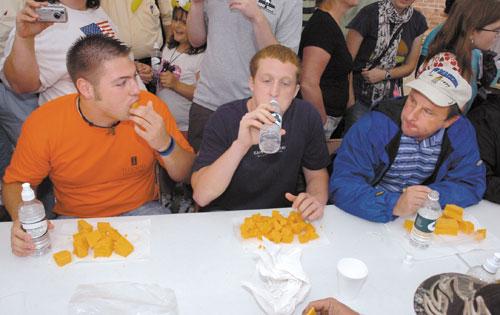 Cheese-eating contest held despite the rain