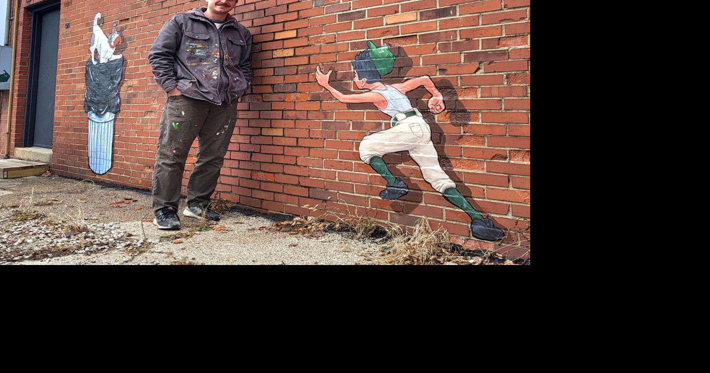 Local artist creating small mural in downtown Mattoon alley
