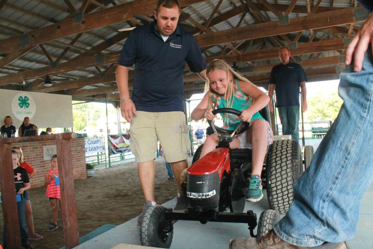 Brother and sister win two top spots in kids' pedal tractor pull