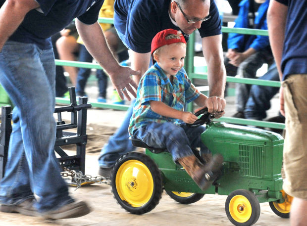Youngsters put their mettle to the pedal in kids' tractor pull contest