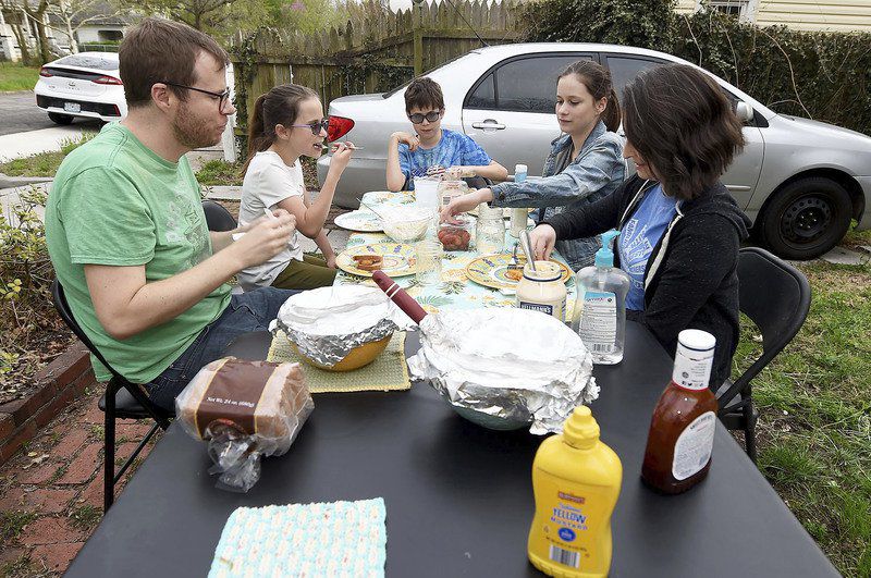 Neighbors maintain social distance while dining on driveways ...
