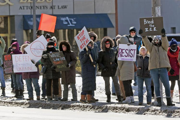 Nearly 100 people protest federal actions at Allen County Courthouse ...