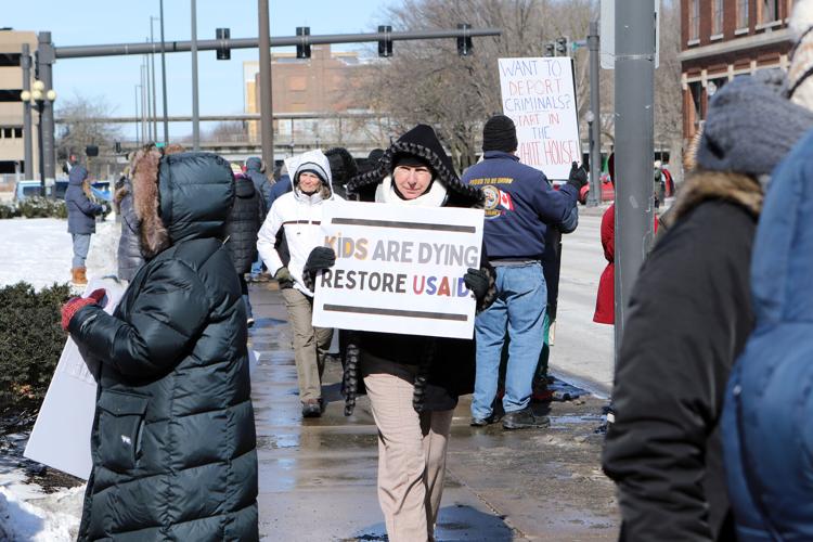 Nearly 100 people protest federal actions at Allen County Courthouse ...