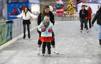 Holding up her cousin at the Headwaters Park ice rink | Local ...