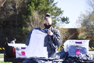 Handing out PFW gear | Local | journalgazette.net