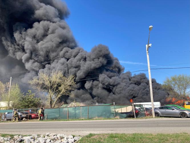 Automotive business barbecue fire spreads to 3 homes, leaves pole barn ...