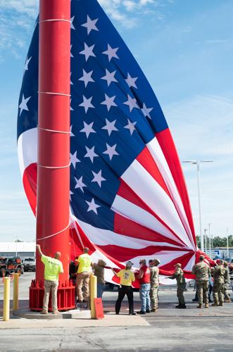 Fort Wayne dealership raises flag on pole replacing one that broke in ...